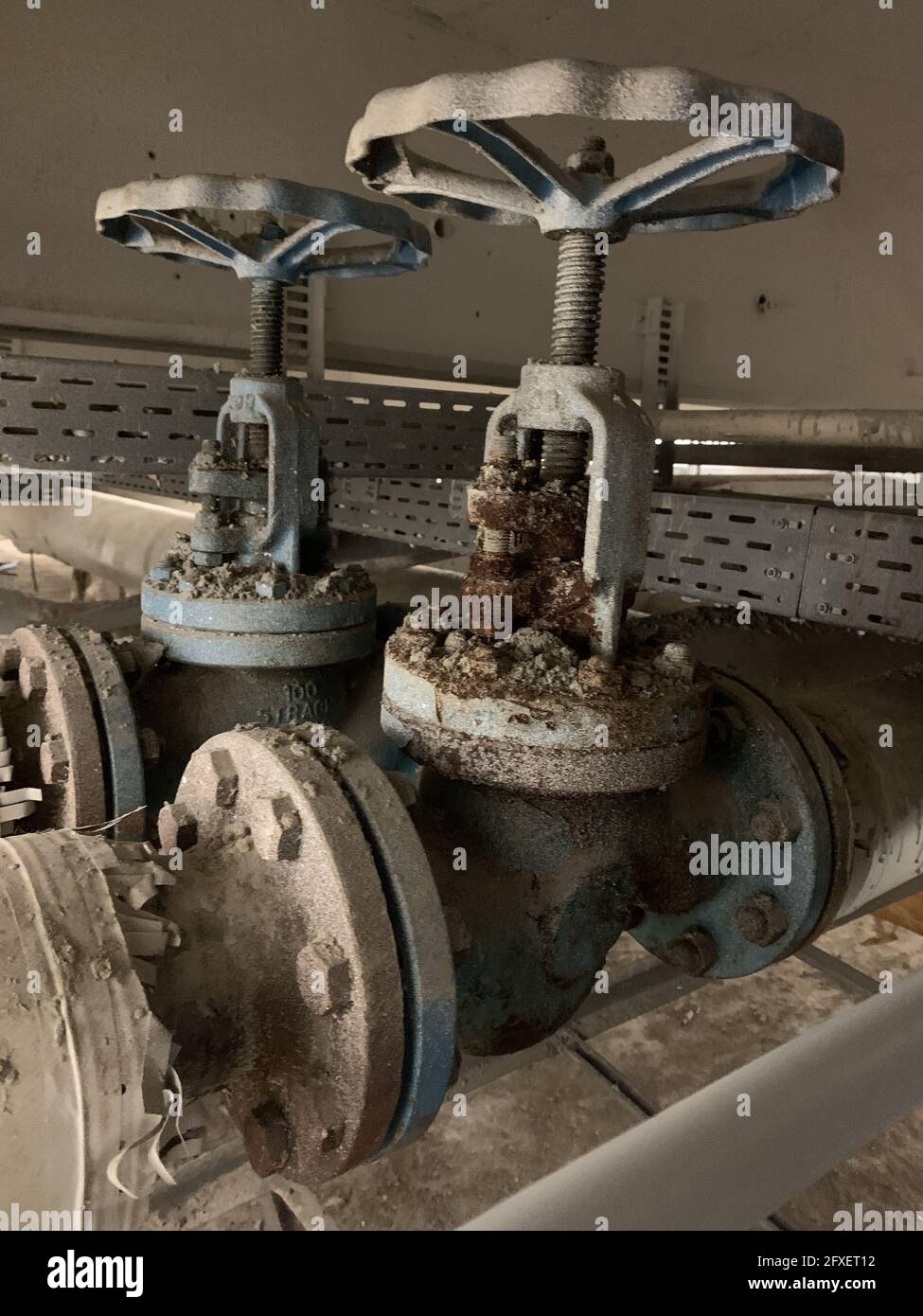 Rusty gate valves in factory Stock Photo - Alamy