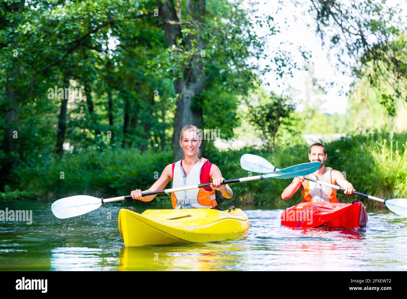 Young friends kayaking hi-res stock photography and images - Alamy