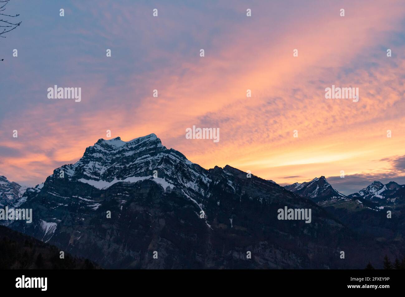 colorful sunset with mountains in swiss alps Stock Photo - Alamy