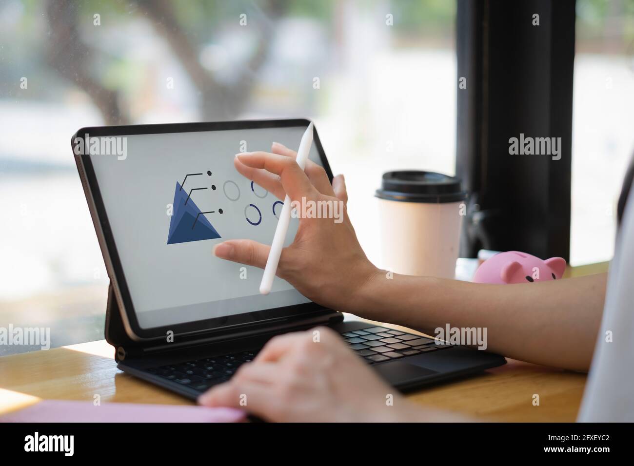 Close up Business woman hand holding stylus and with financial chart on ...