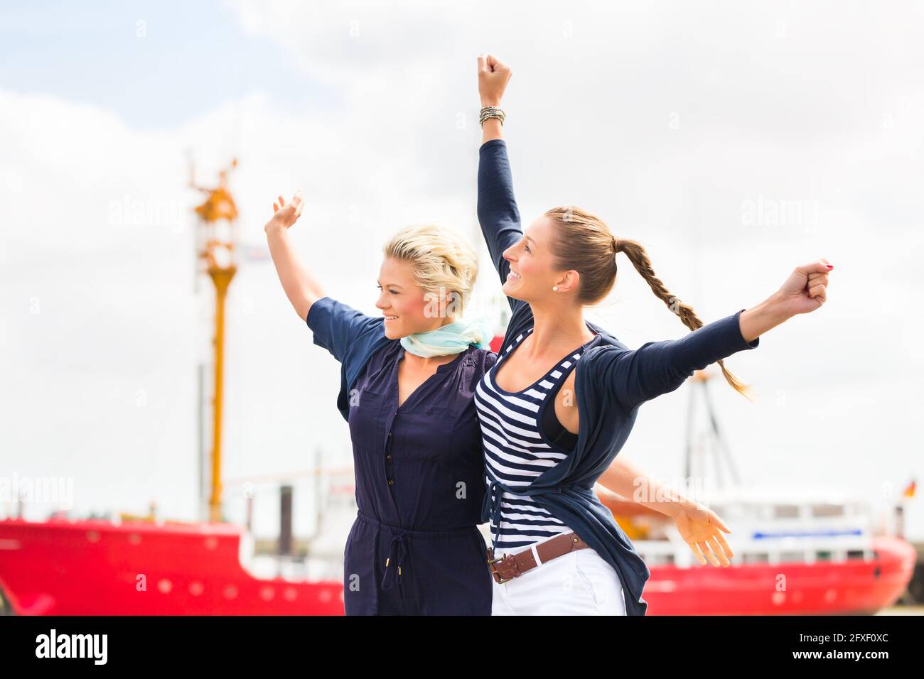 Woman enjoying vacation at German north sea ship pier in harbor Stock ...