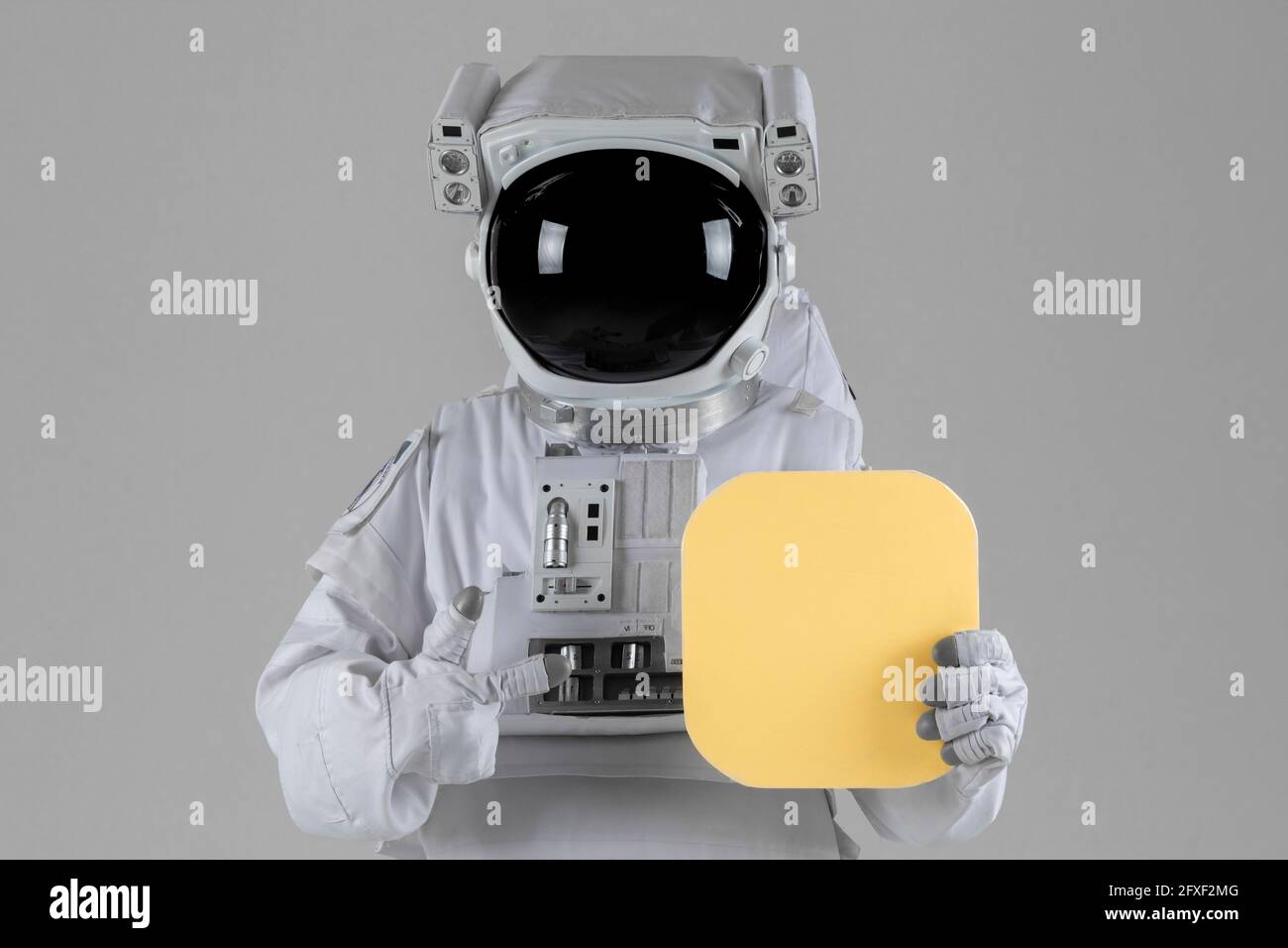 Astronaut pointing at the event banner in hand, white background Stock ...