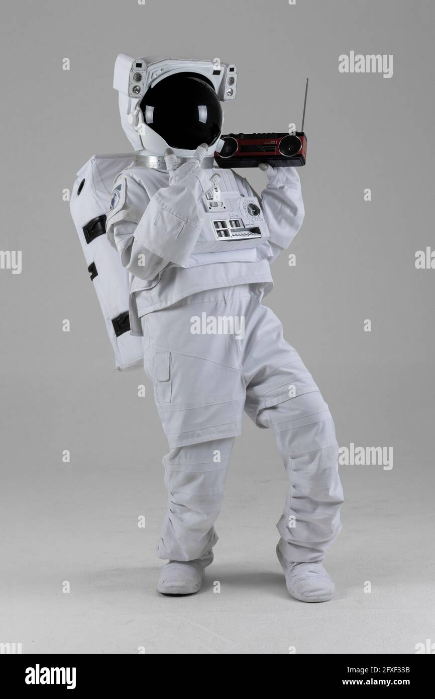 happy astronaut listening to radio music, white background Stock Photo ...