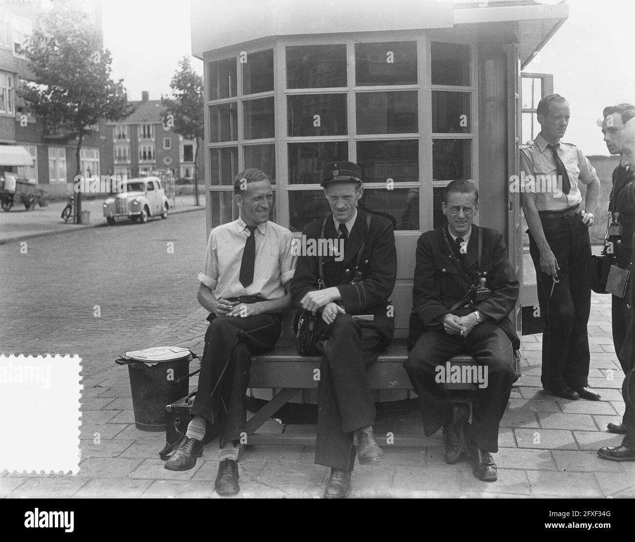 Tram conductor with and without jacket Amsterdam, July 7, 1952 ...