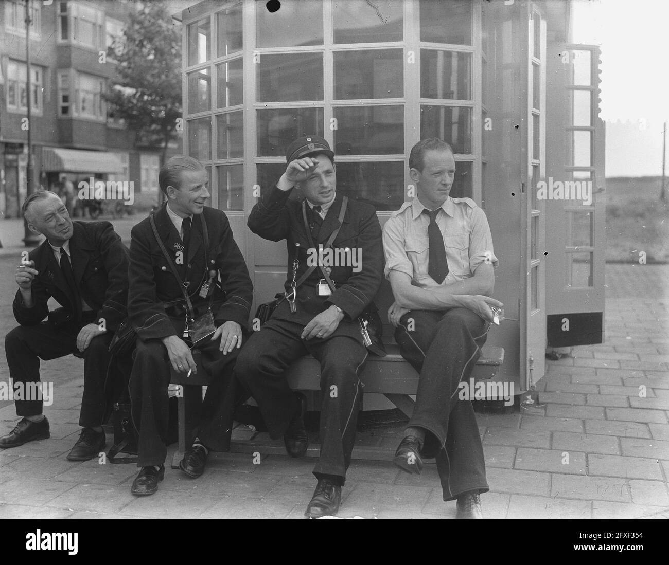 Tram conductor with and without jacket Amsterdam, 7 July 1952, The ...