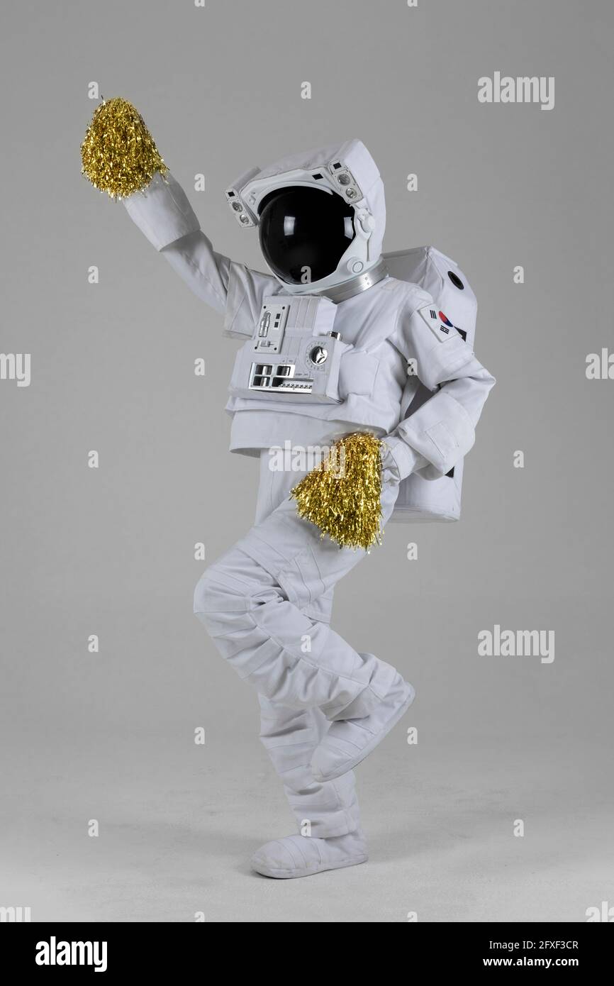 astronaut with cheer pompom, white background Stock Photo - Alamy