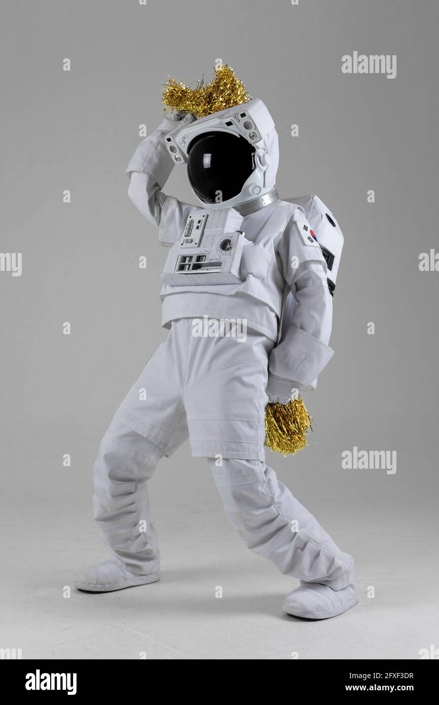 astronaut with cheer pompom, white background Stock Photo - Alamy