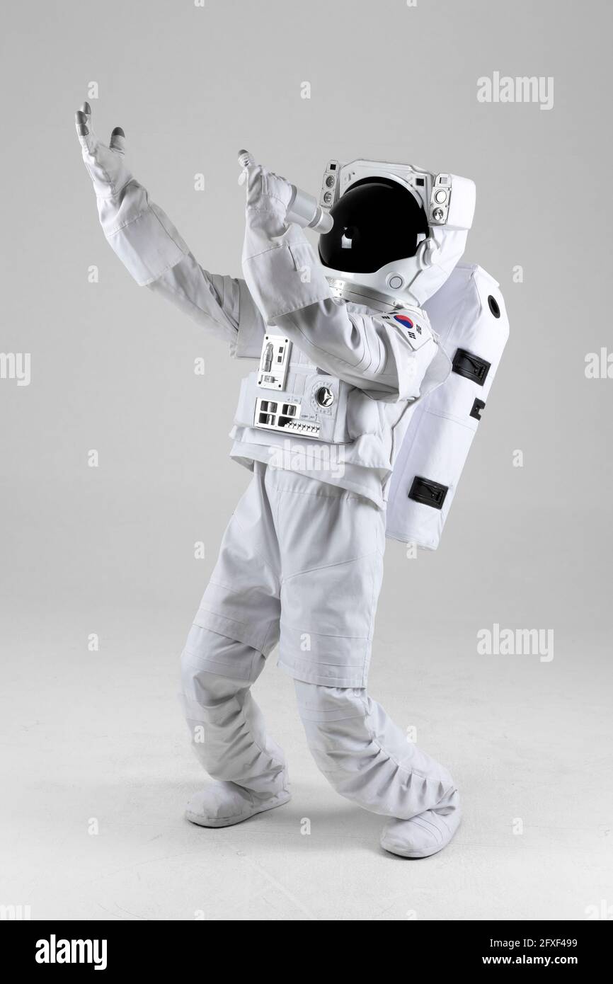 Astronaut singing and dancing with microphone, white background Stock ...
