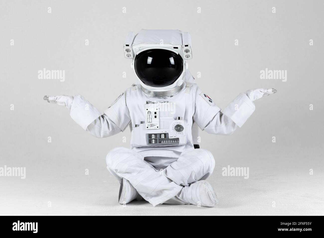 astronaut pointing right and left, white background Stock Photo - Alamy