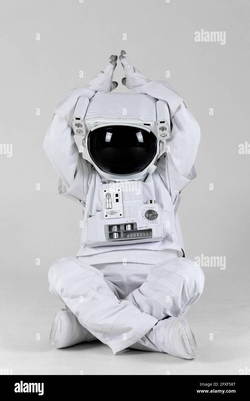 stretching astronaut, white background Stock Photo - Alamy