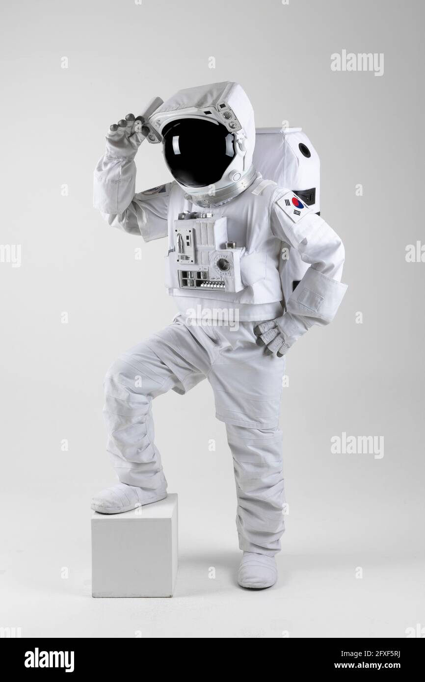 astronaut with raised legs, white background Stock Photo - Alamy