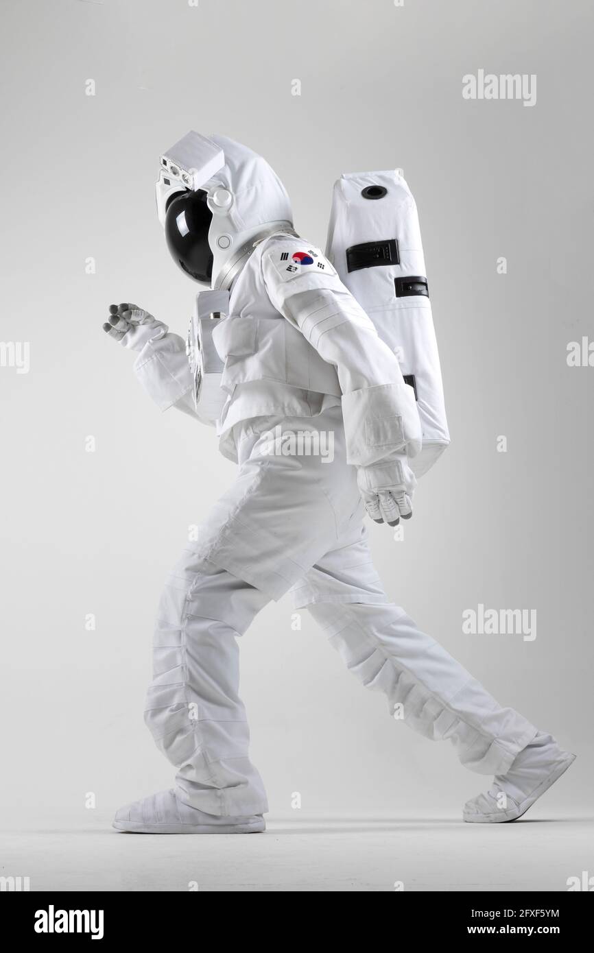Vigorous walking astronaut, white background Stock Photo - Alamy