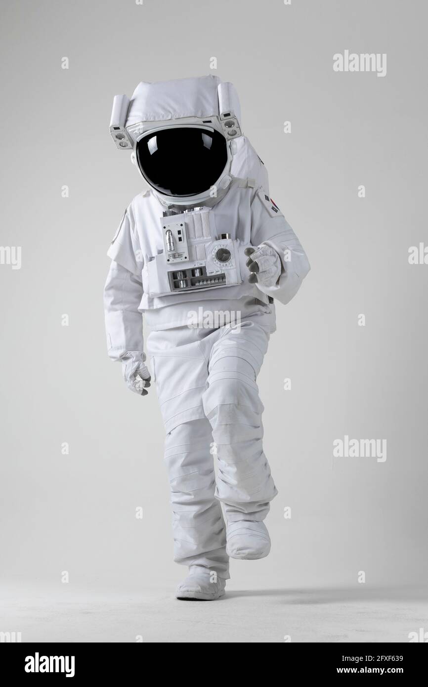 running astronaut, white background Stock Photo - Alamy