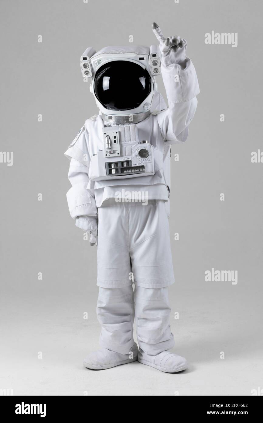 astronaut touching empty space, white background Stock Photo - Alamy