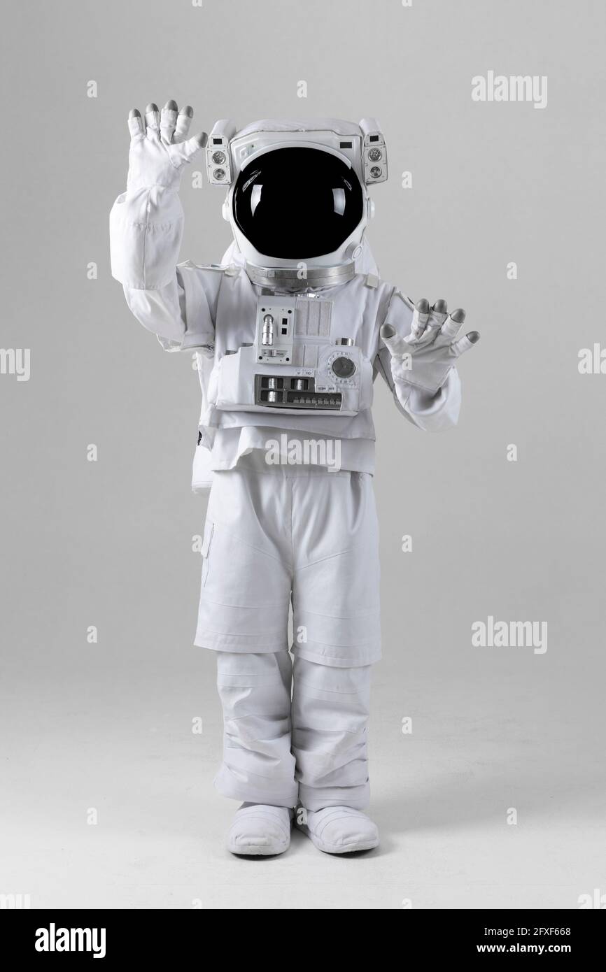 astronaut touching empty space, white background Stock Photo - Alamy