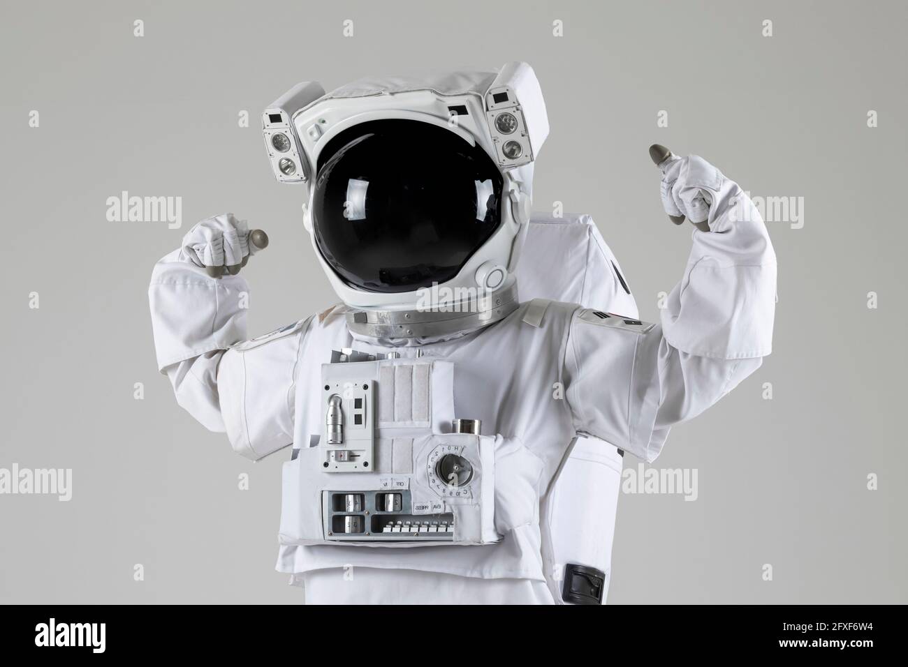 astronaut displaying muscles,white background Stock Photo - Alamy