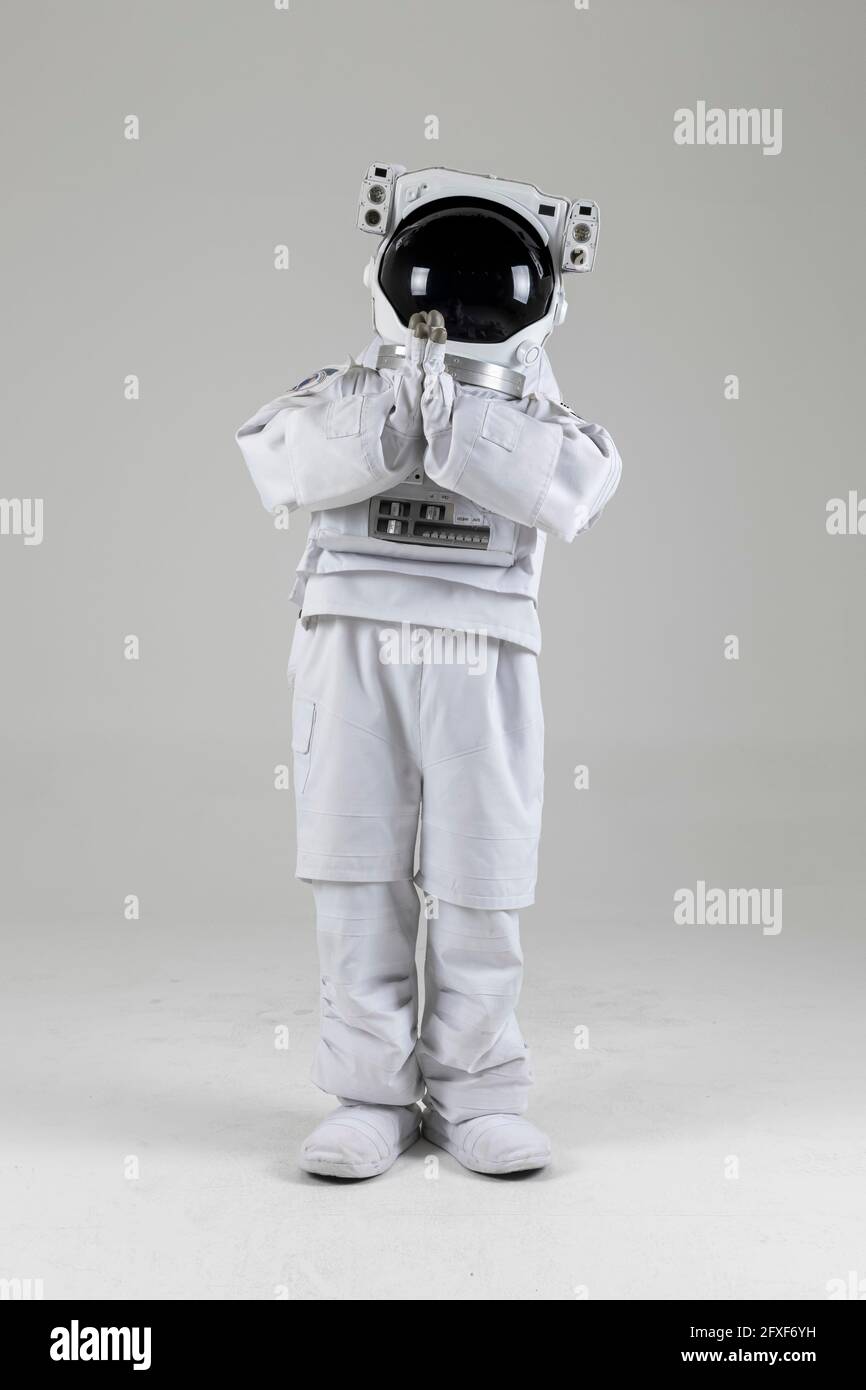 praying astronaut, white background Stock Photo - Alamy