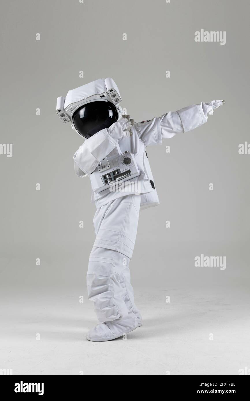 Astronaut takes a hip pose, white background Stock Photo - Alamy