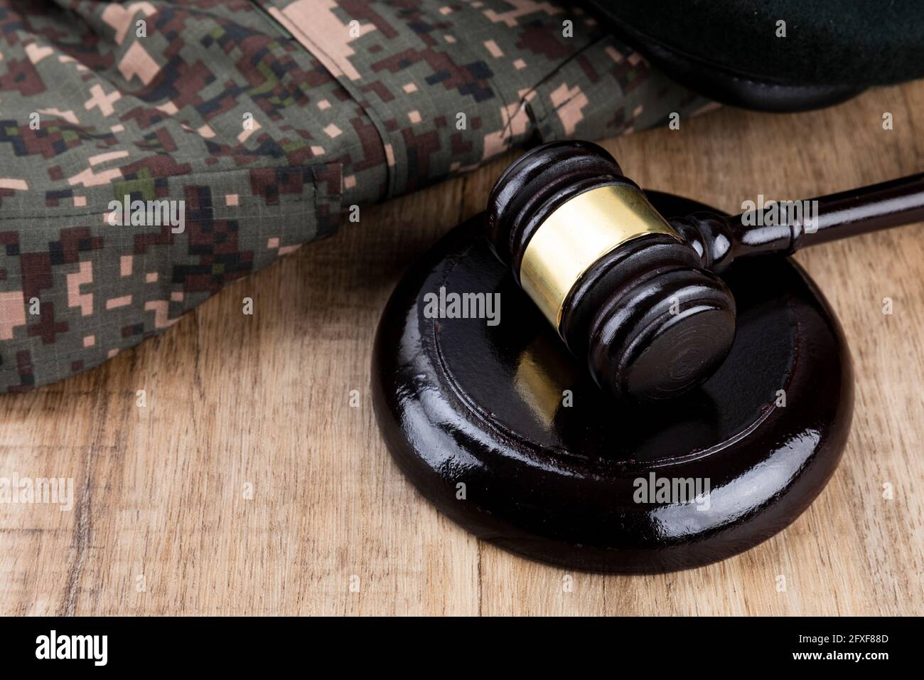 Crime and law - gavel placed in front of military uniforms Stock Photo ...