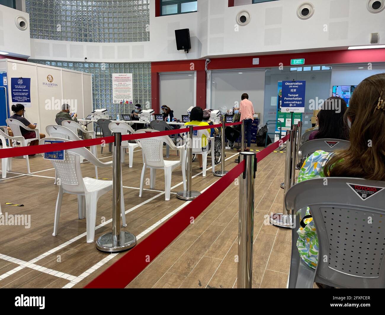 Newly vaccinated people wait for 30 minutes in the COVID-19 vaccination ...