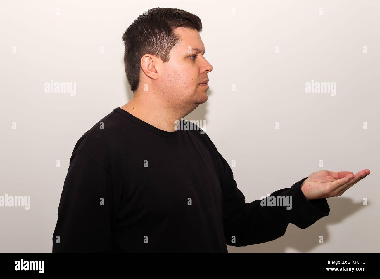 Brazilian male showing beggar hands sign Stock Photo - Alamy