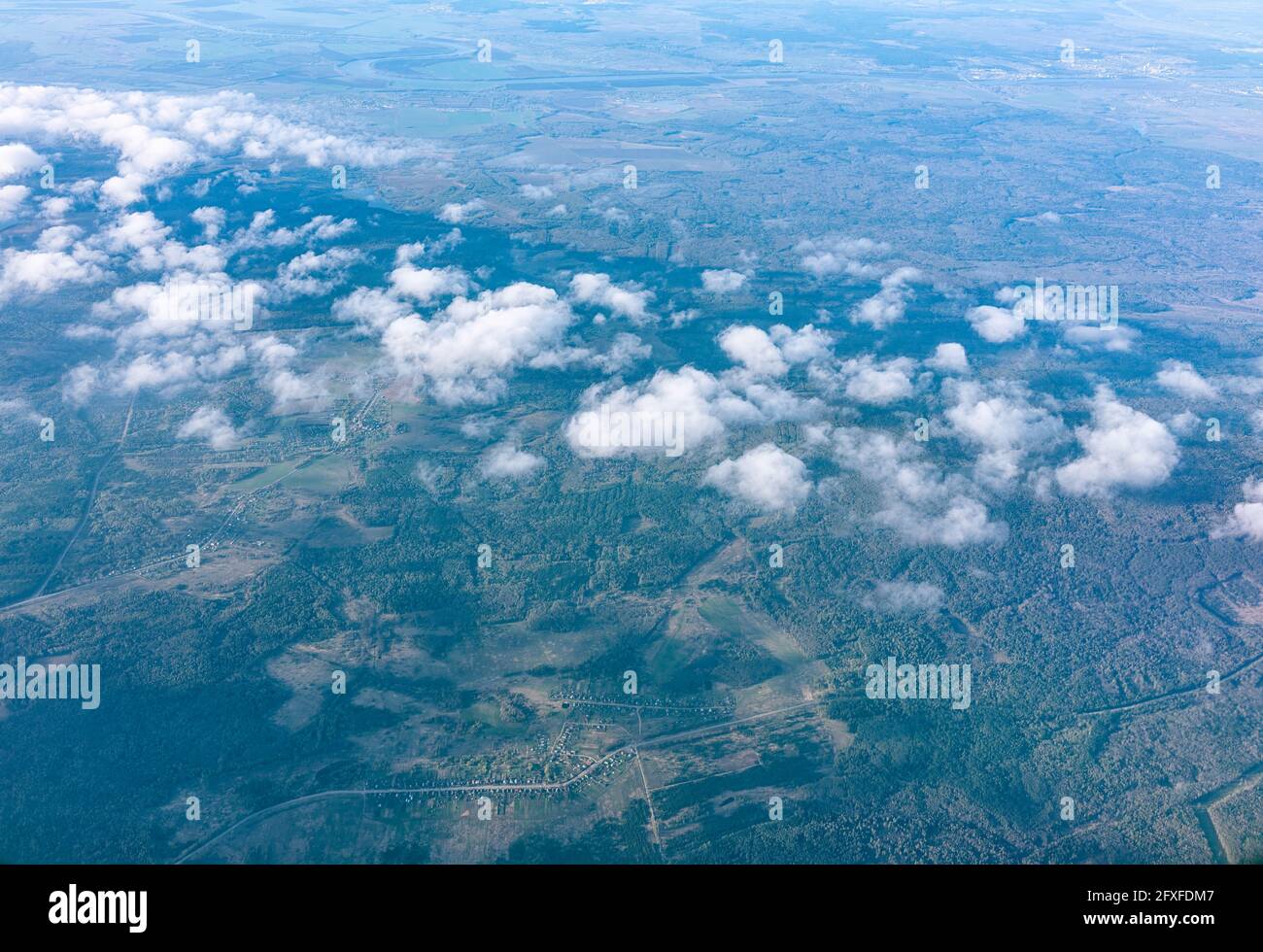 Aerial view from airplane window above grenn ground. View from the ...