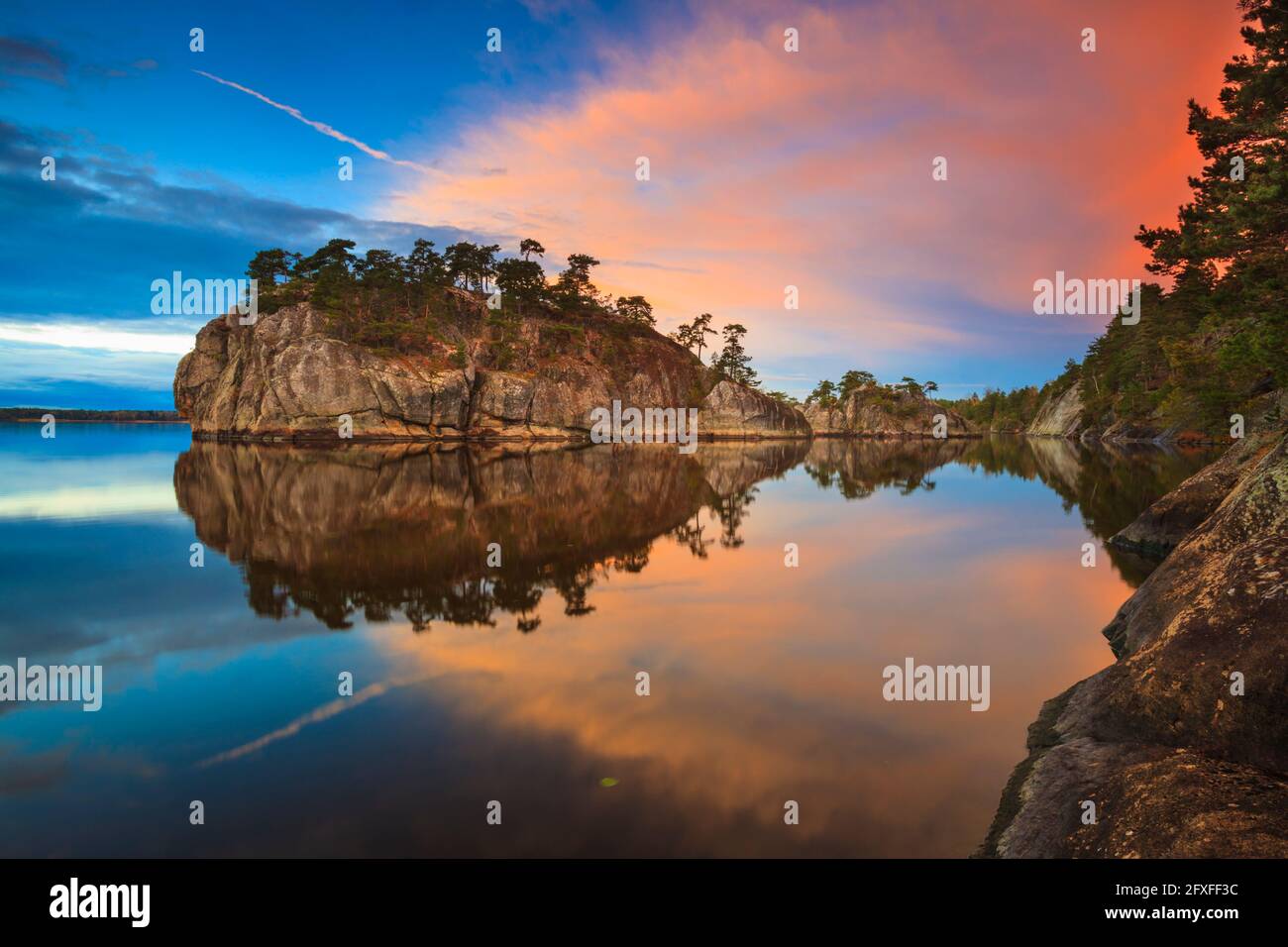 Autumn evening with colorful sky and reflections at the cliff called ...