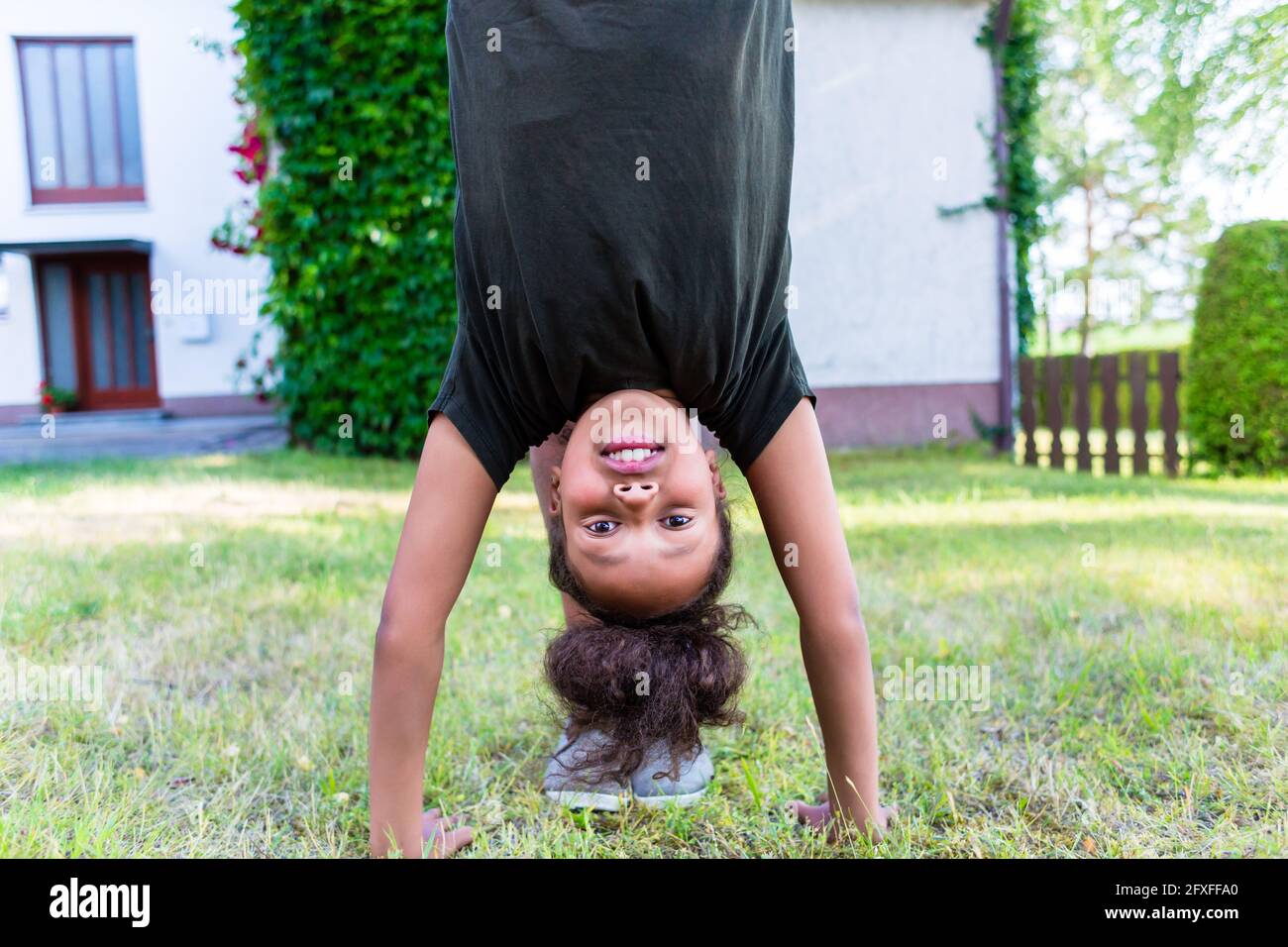 Girl doing handstand hi-res stock photography and images - Alamy