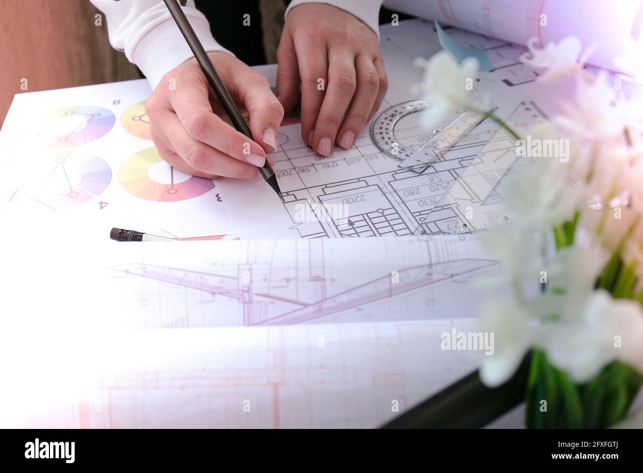 Hands use pencil with a protractor. Architectural Project drawings with ...