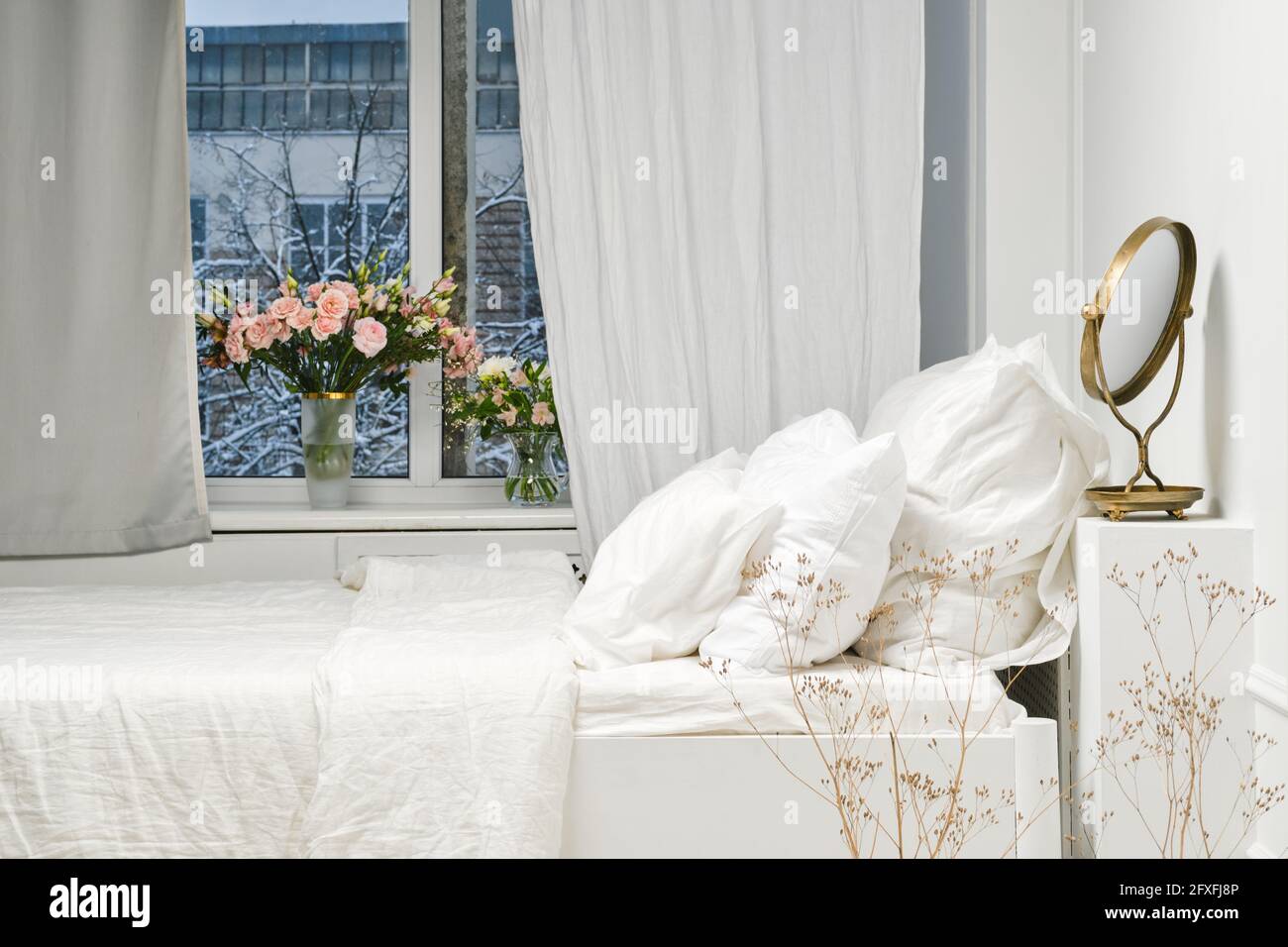 Side view of a bed with pillows in a loft room Stock Photo - Alamy