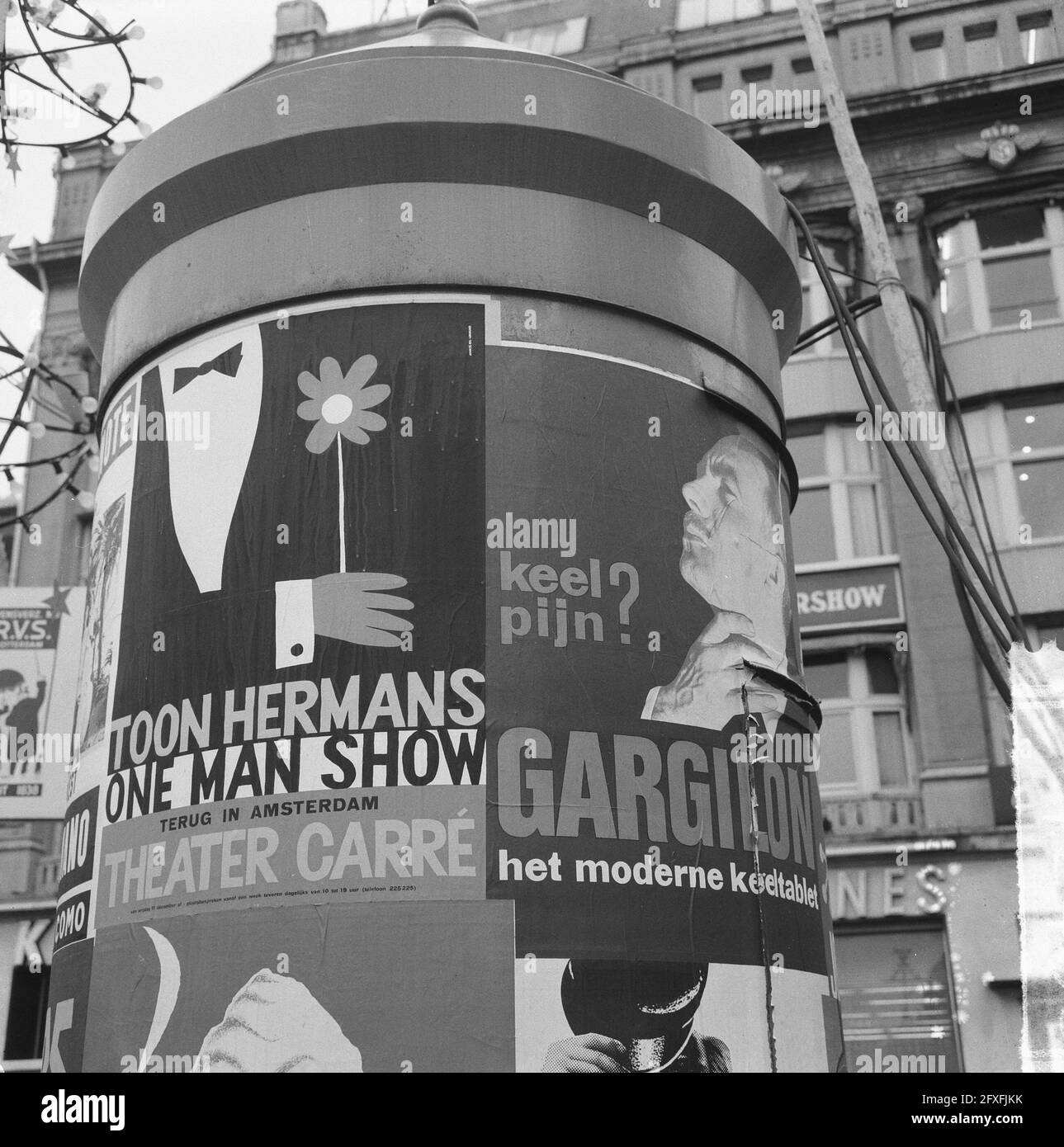 Two posters on pepperbox on Leidseplein, very much related to each ...