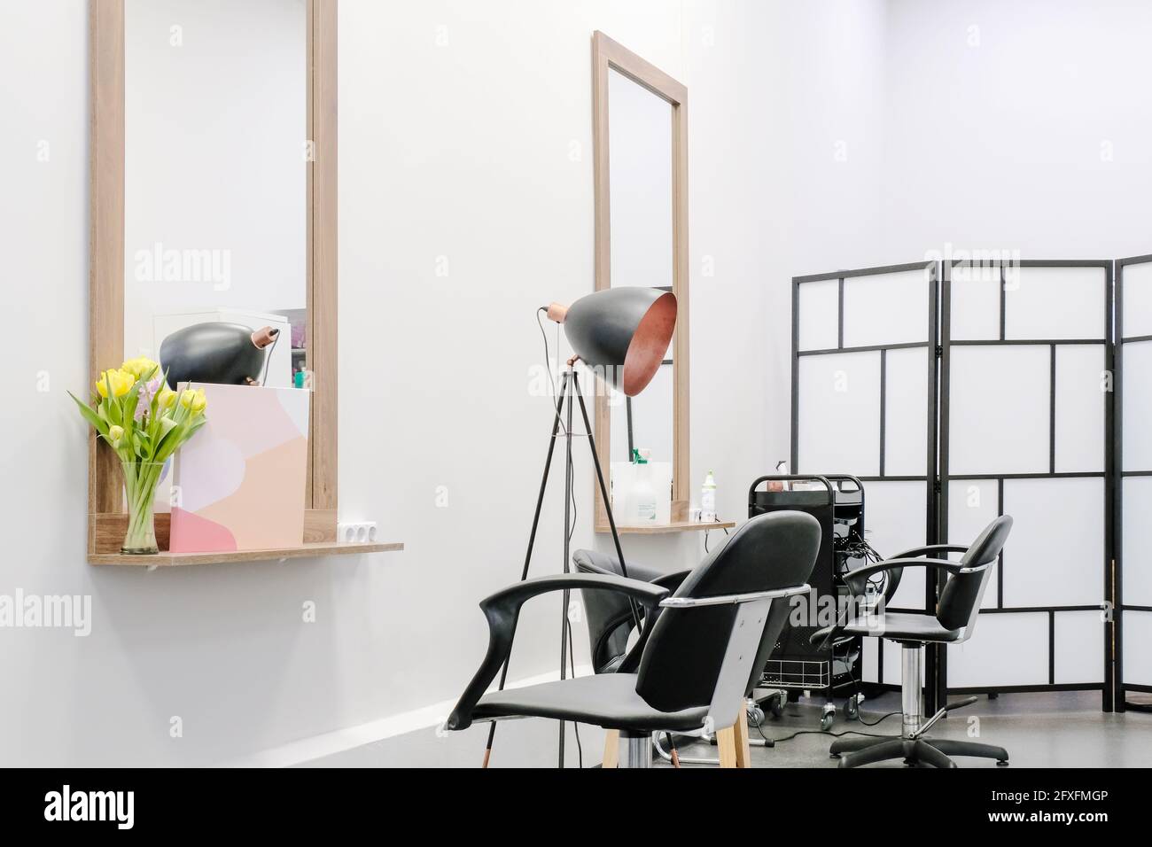 The interior of the modern hairdressing salon with a professional ...