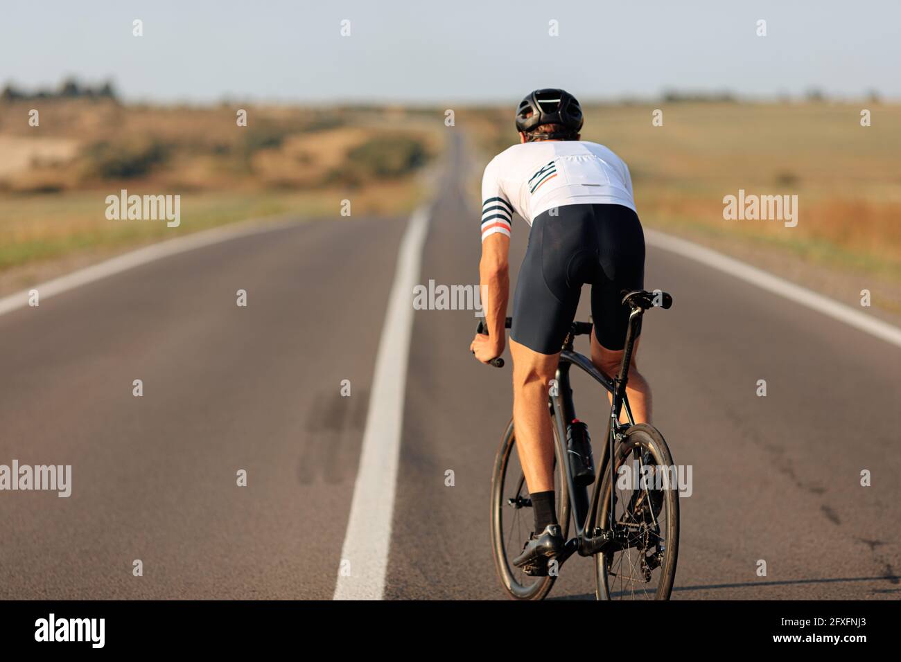 Back view man bike hi-res stock photography and images - Alamy
