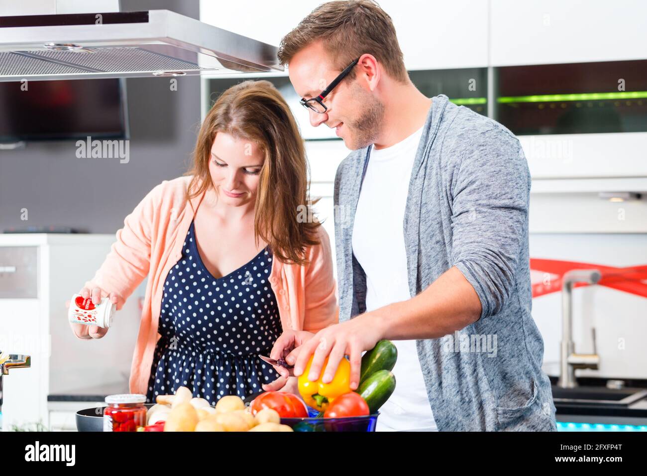 Couple kitchen meat hi-res stock photography and images - Alamy