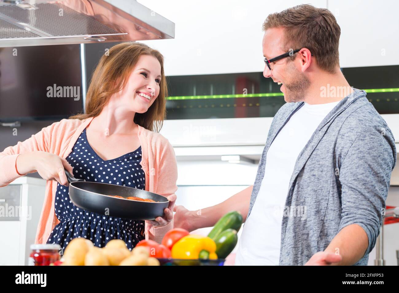 Couple kitchen meat hi-res stock photography and images - Alamy