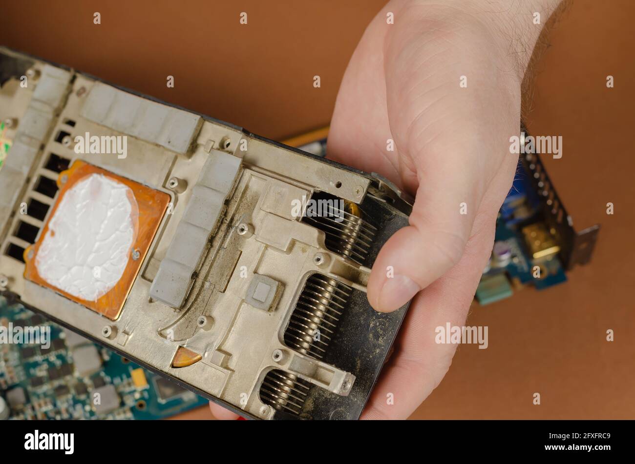 Computer repair services and components concept. A man is holding a ...