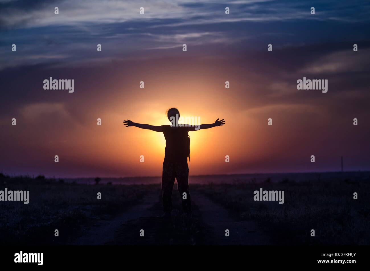 silhouette of a human in full-length in the rays of the sunset Stock ...