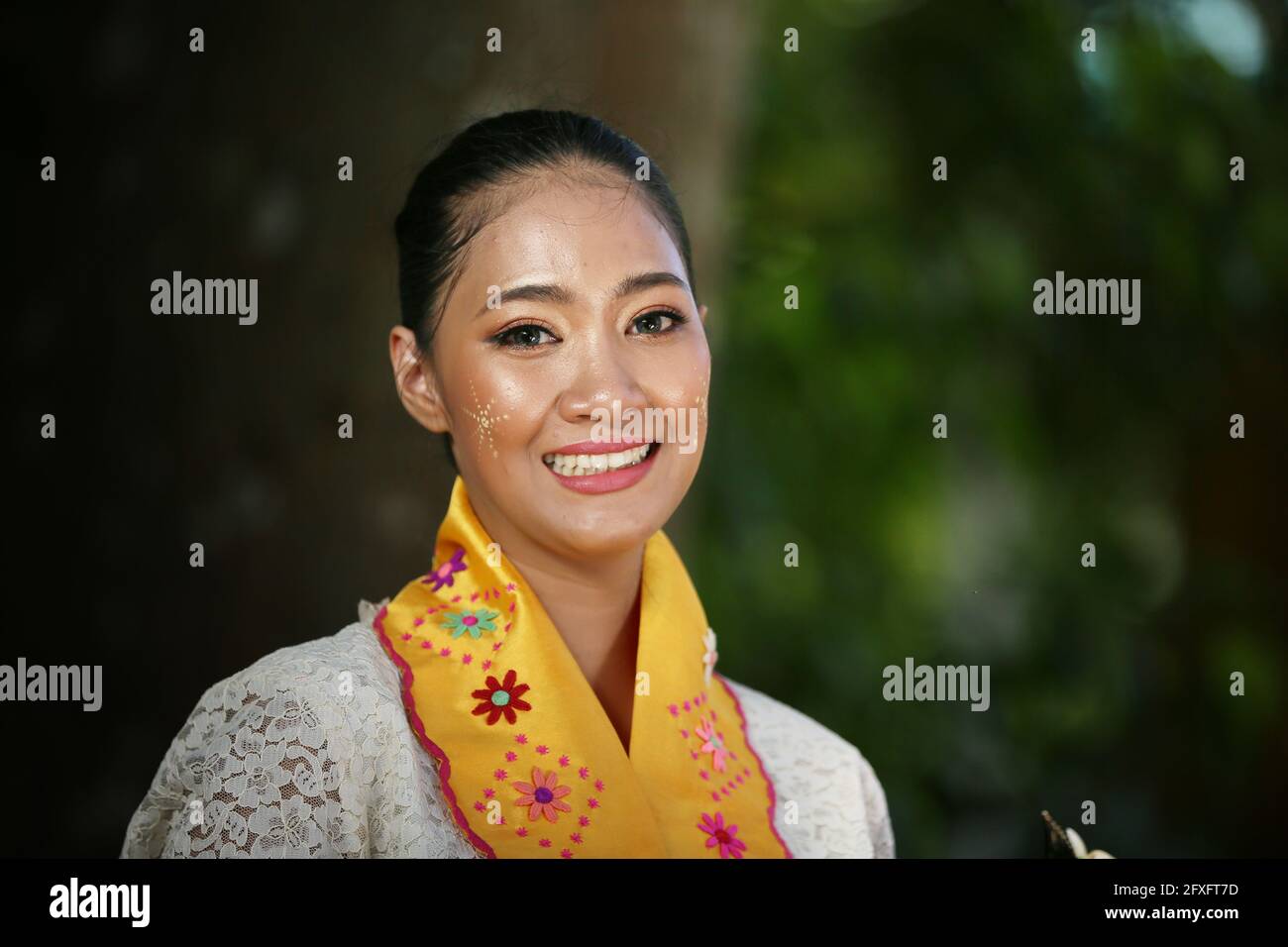 Portrait of a Burmese girl with traditional Thanaka face painting in ...