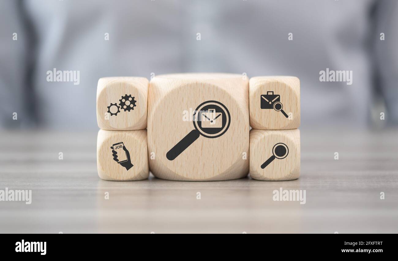 Wooden blocks with symbol of job search concept Stock Photo - Alamy