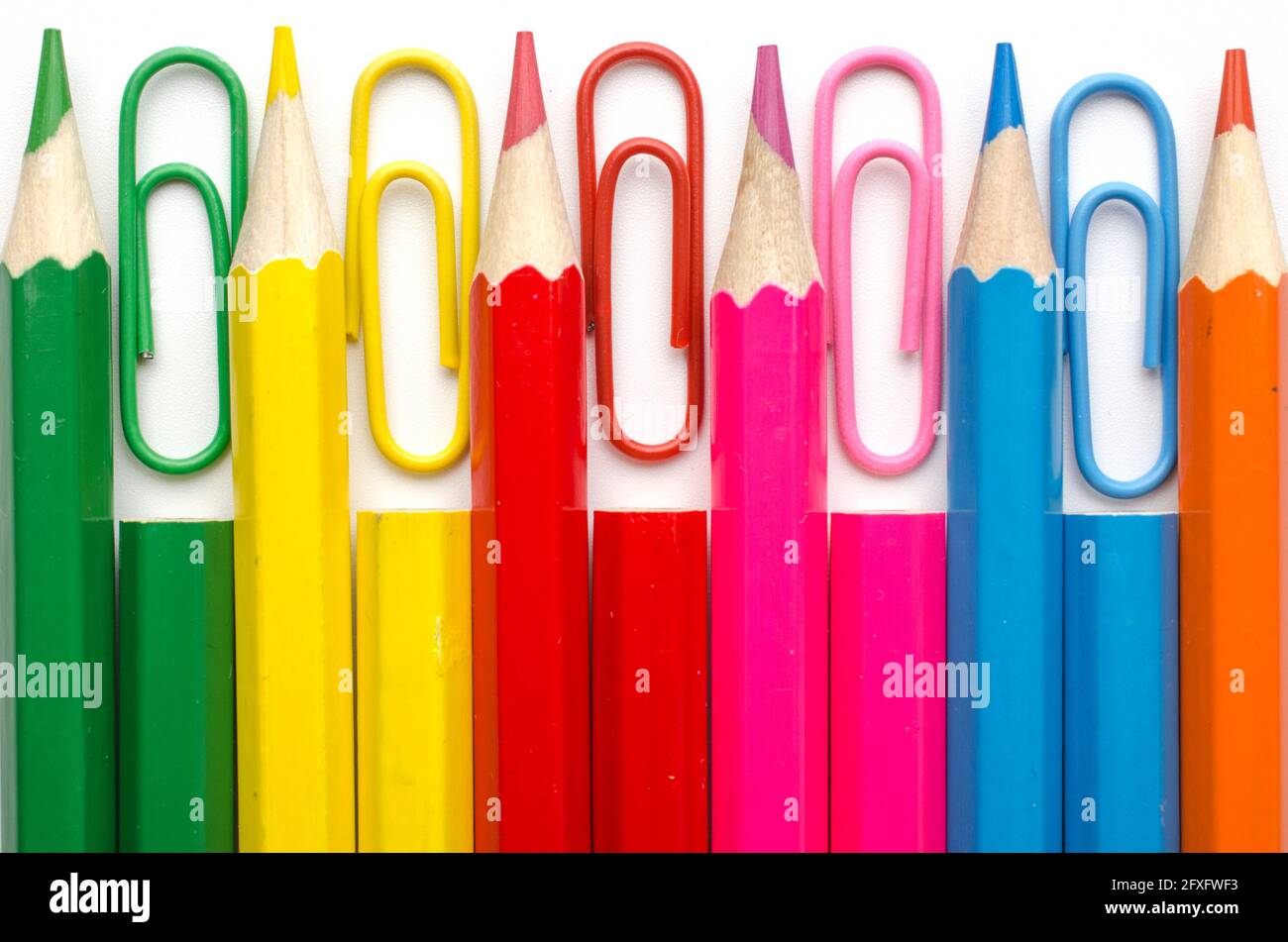 set of colored pencils and paper clips isolated on white Stock Photo ...