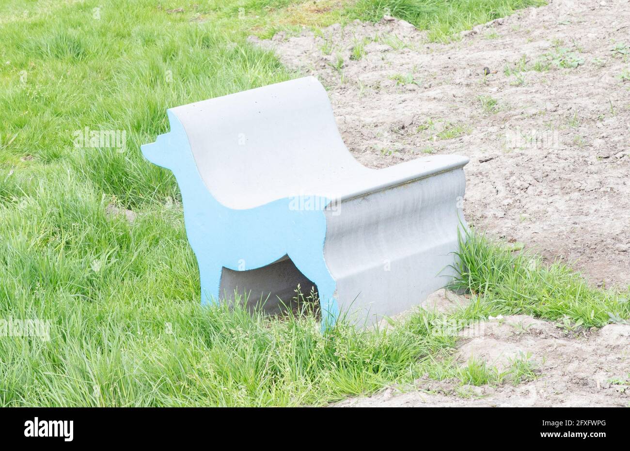 Sculpture concrete bench in the park, dog Stock Photo - Alamy