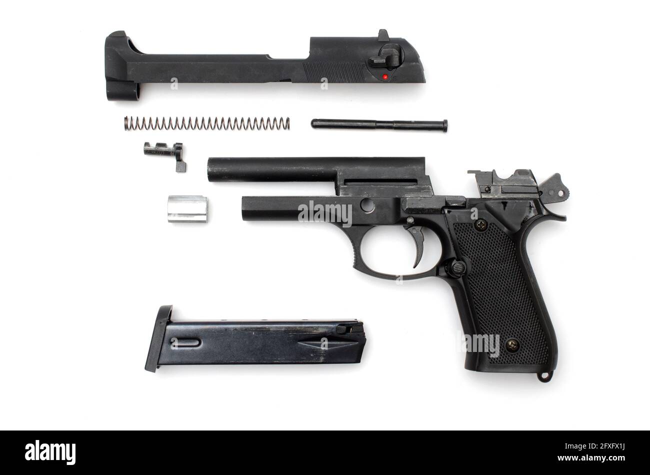 disassembled gun on a white background Stock Photo - Alamy