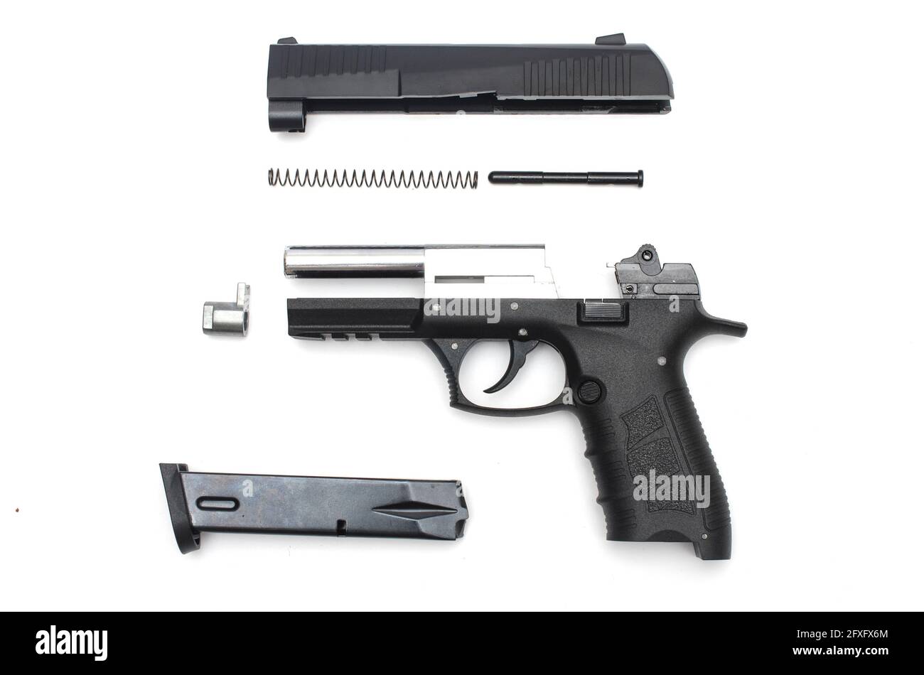 disassembled gun on a white background Stock Photo - Alamy