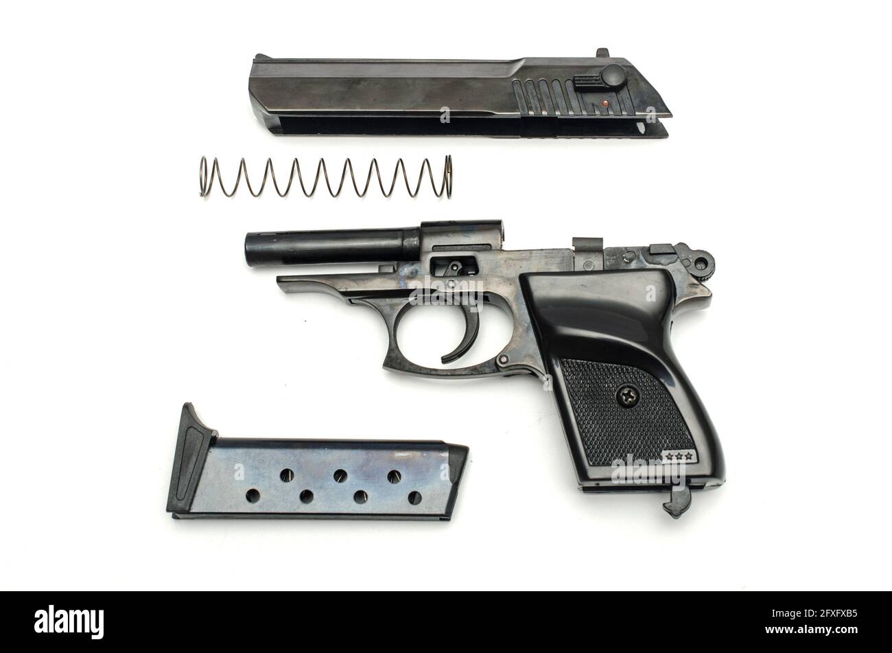disassembled gun on a white background Stock Photo - Alamy
