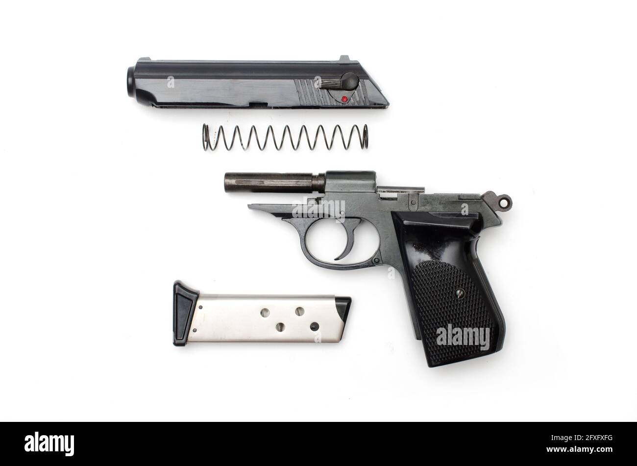 disassembled gun on a white background Stock Photo - Alamy