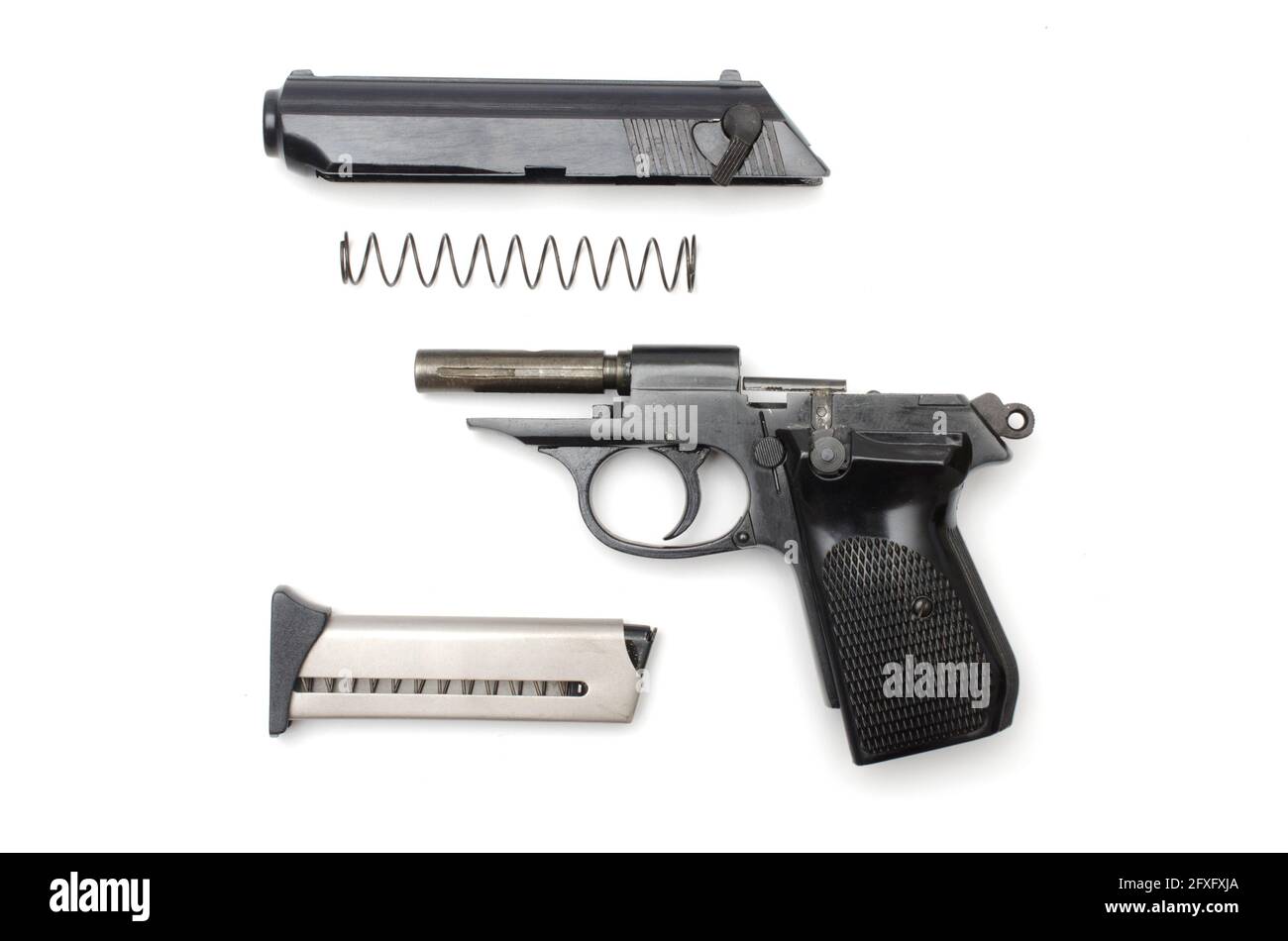 disassembled gun on a white background Stock Photo - Alamy