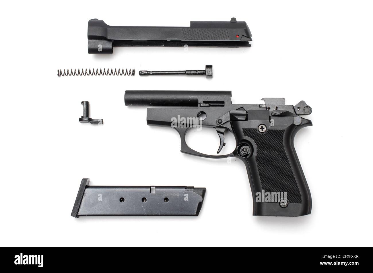 disassembled gun on a white background Stock Photo - Alamy