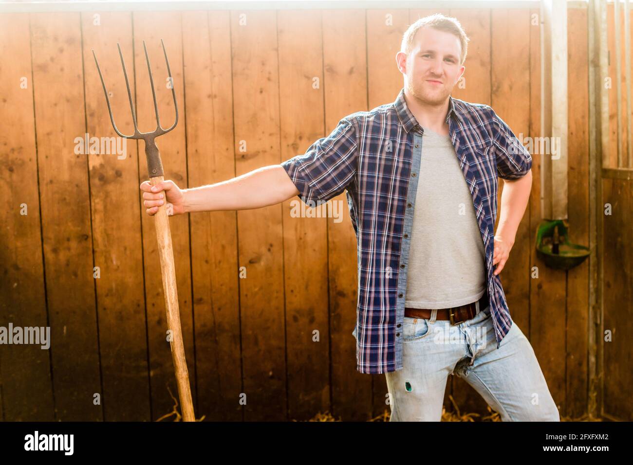 Man with pitchfork hi-res stock photography and images - Alamy