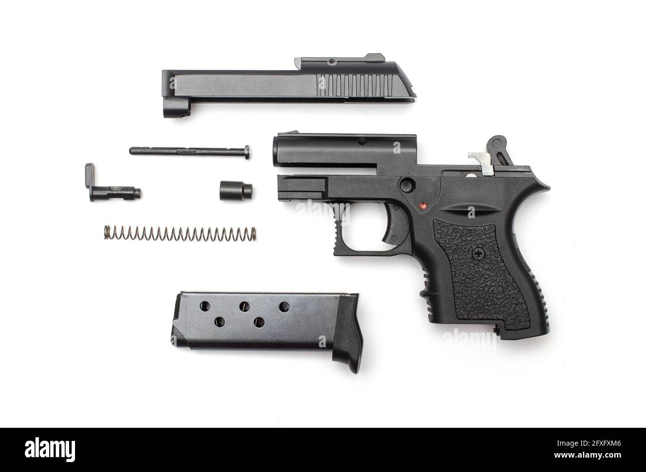 disassembled gun on a white background Stock Photo - Alamy