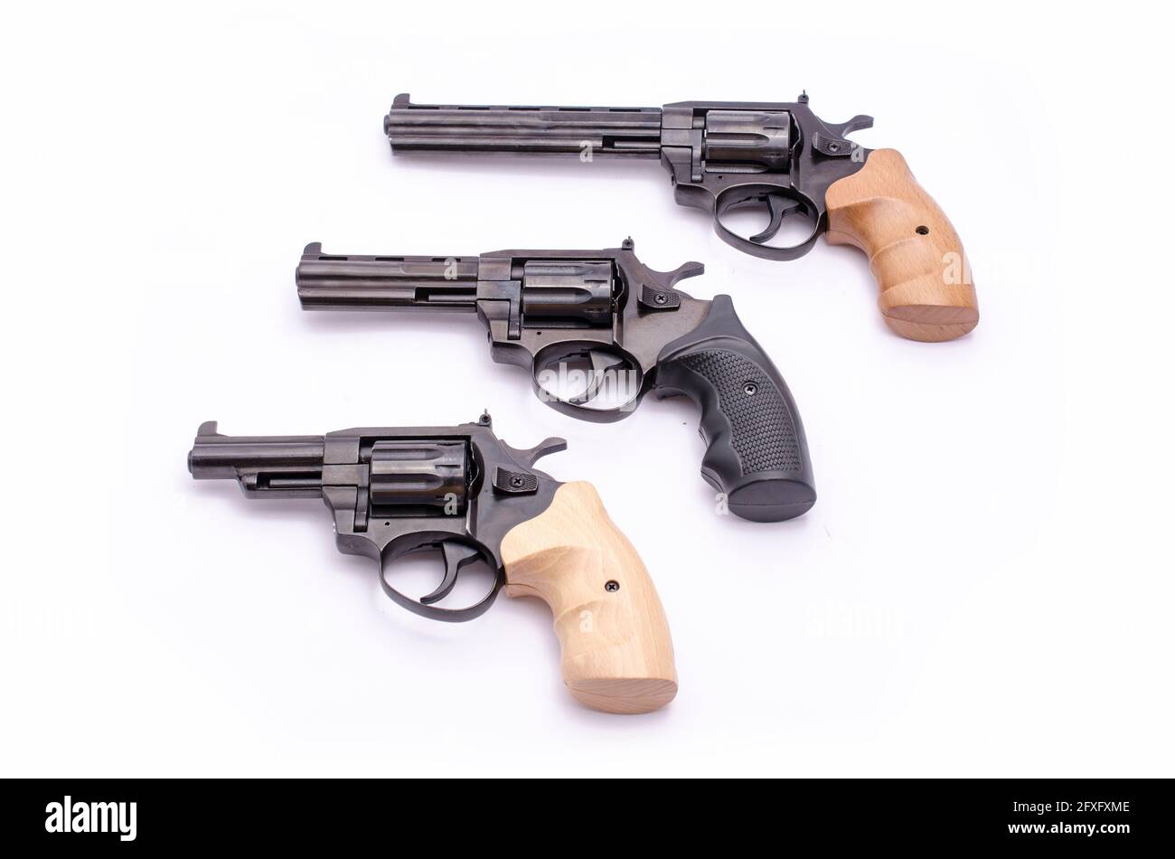 three revolvers with gun drums isolated on white Stock Photo - Alamy